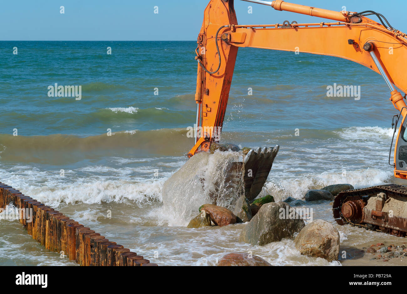 construction equipment on the shore, the construction of breakwaters ...