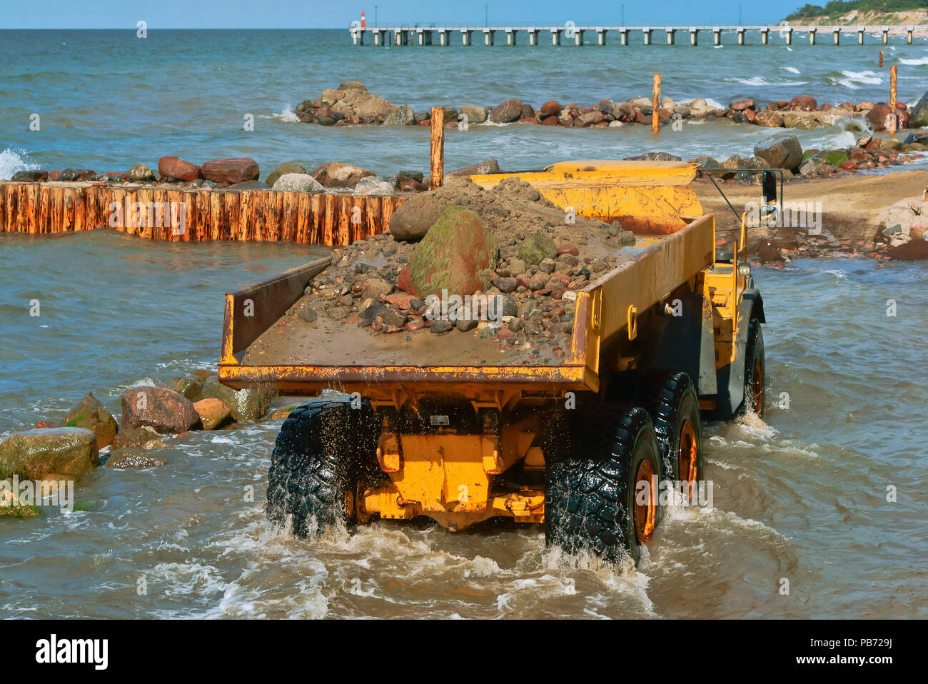 construction equipment on the shore, the construction of breakwaters ...