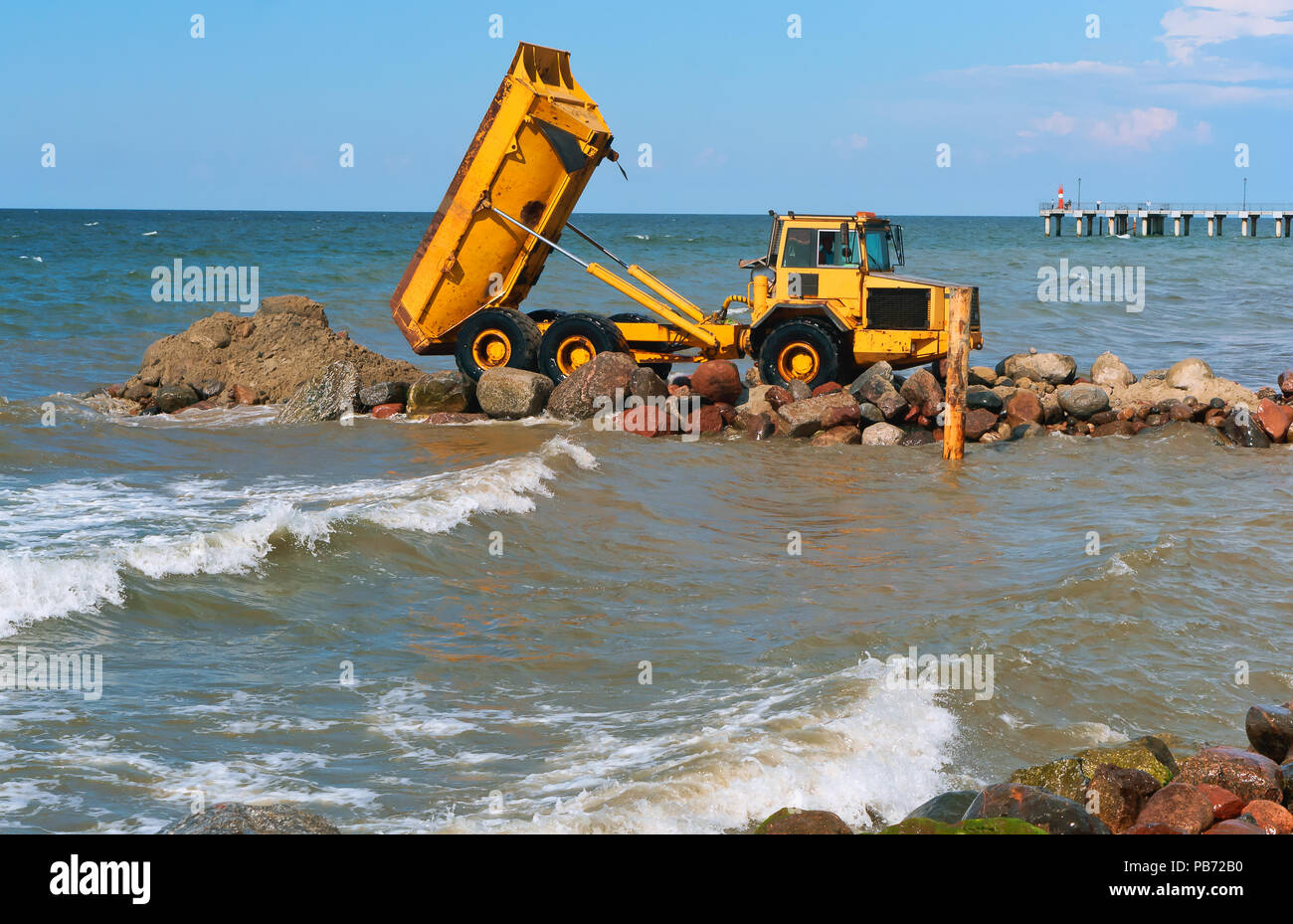 construction equipment on the shore, the construction of breakwaters ...