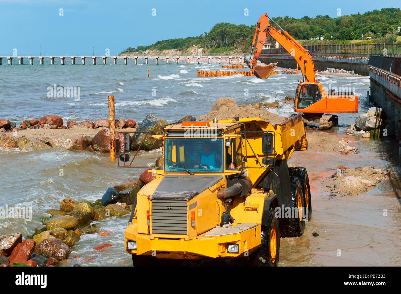construction equipment on the shore, the construction of breakwaters ...