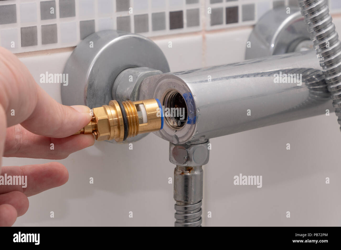 View of a bar shower flow valve with being replaced Stock Photo - Alamy