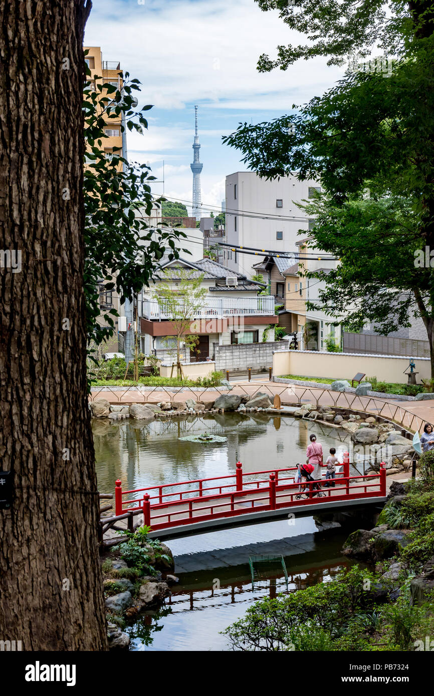 Mother and children contemplate the peaceful surroundings of a small ...