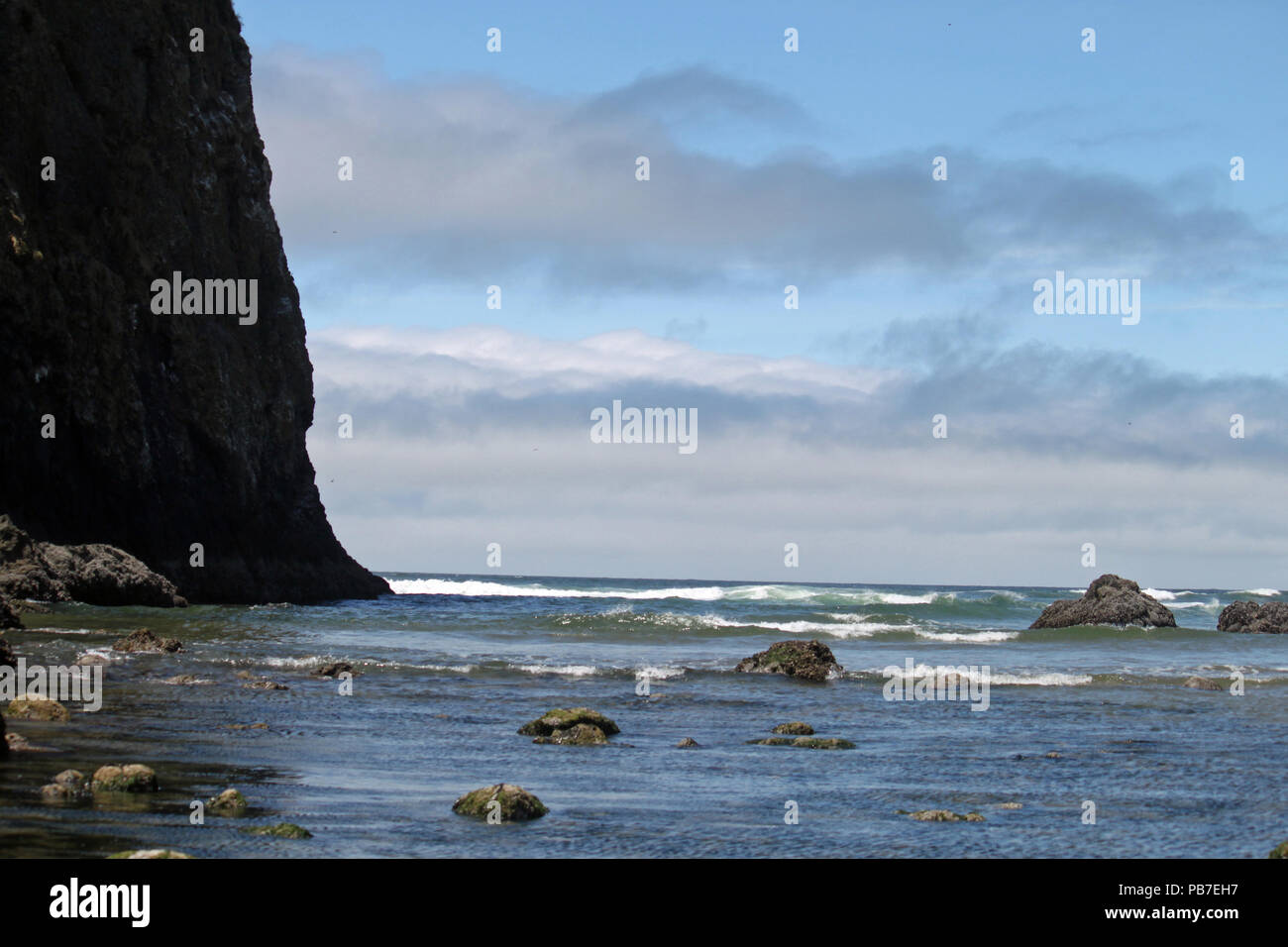 A view of a cliff going into the Pacific ocean Stock Photo - Alamy