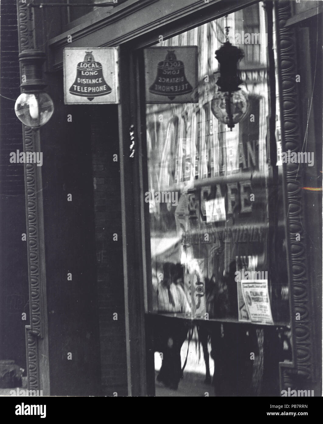 1602 Telephone sign outside of the window of an unidentified restaurant ...