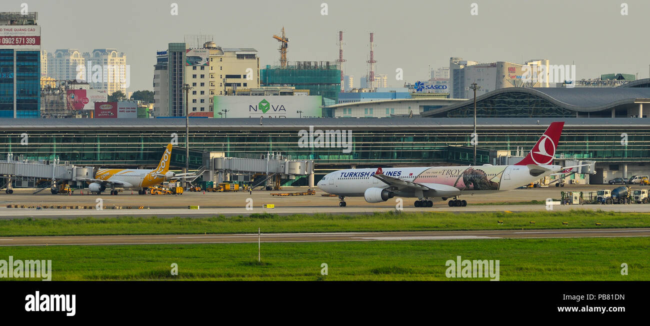 Saigon, Vietnam - Jul 26, 2018. Passenger airplanes taxiing on runway ...