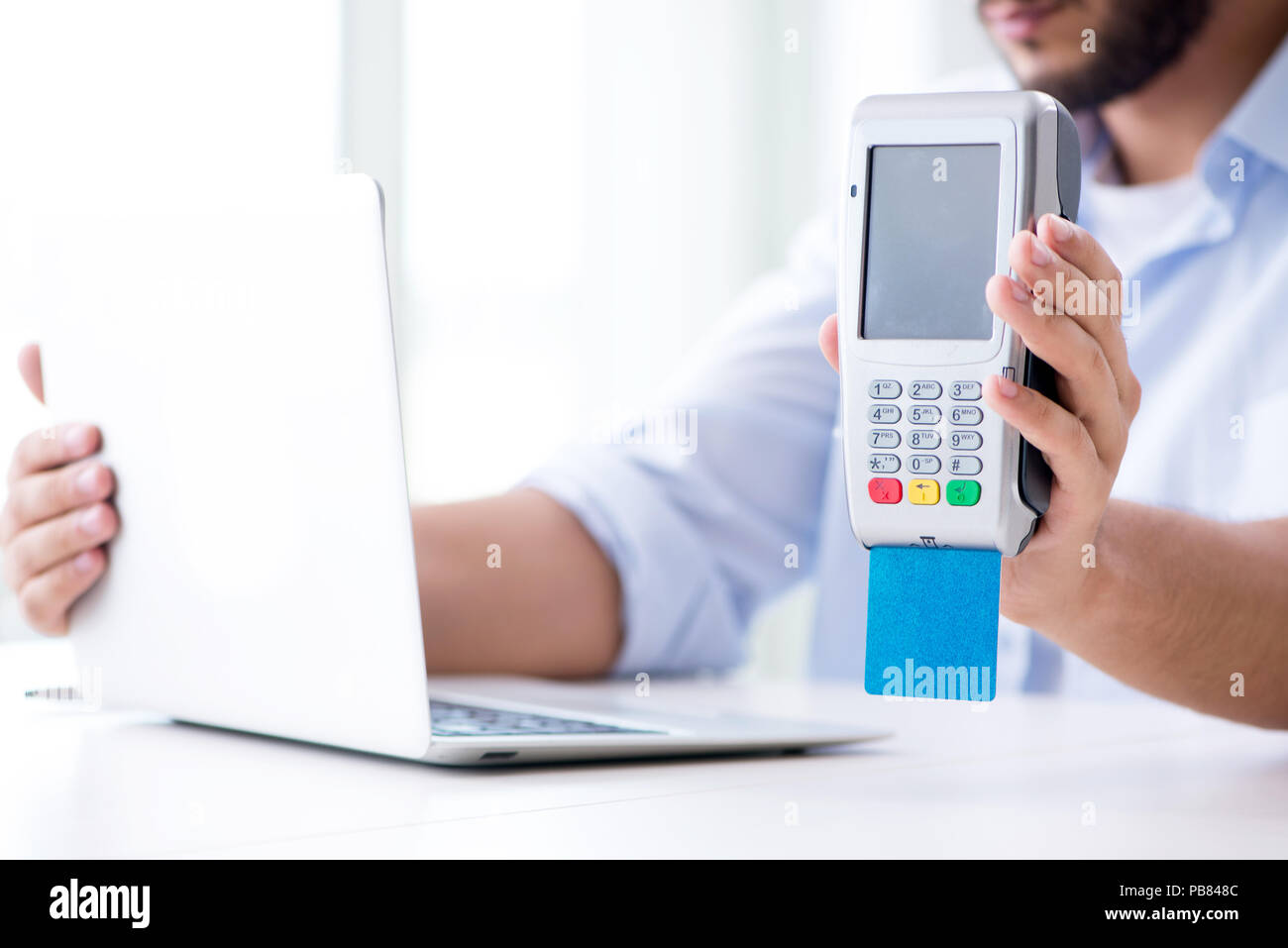 Man processing credit card transaction with POS terminal Stock Photo ...