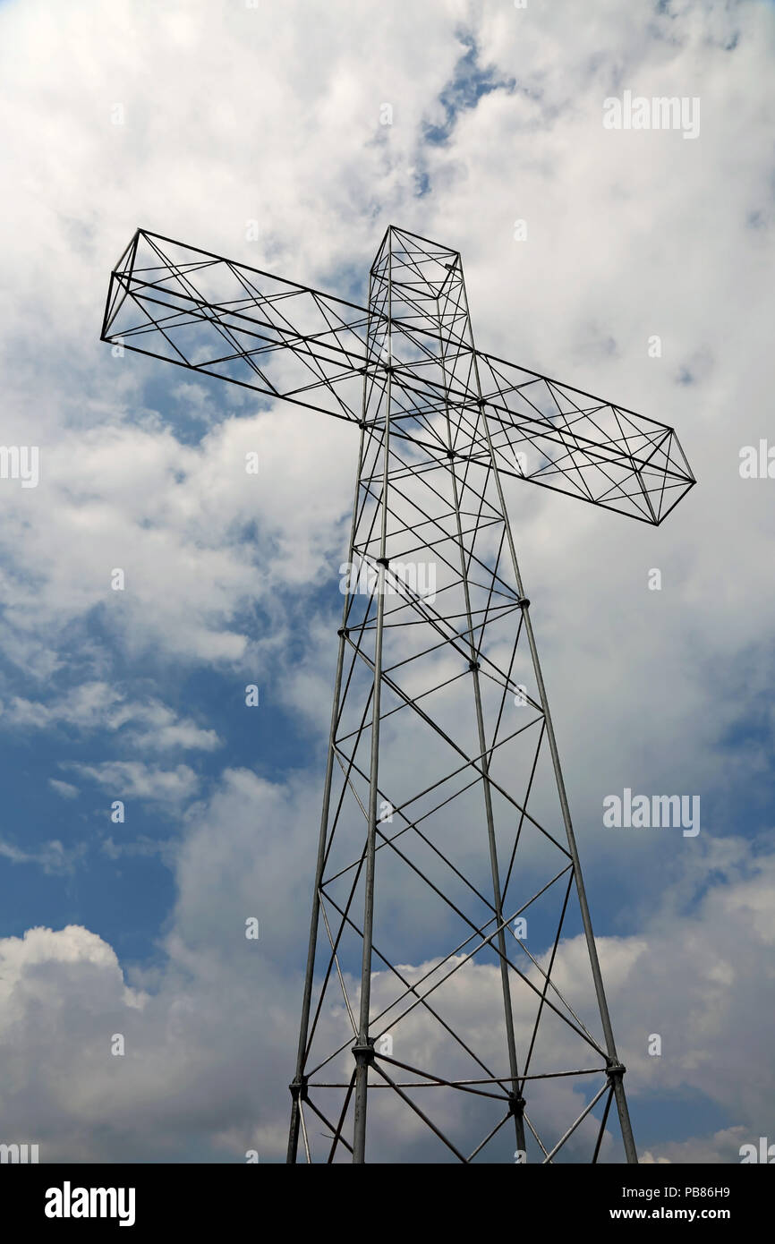big cross on top of mountain with white clouds on the sky Stock Photo ...