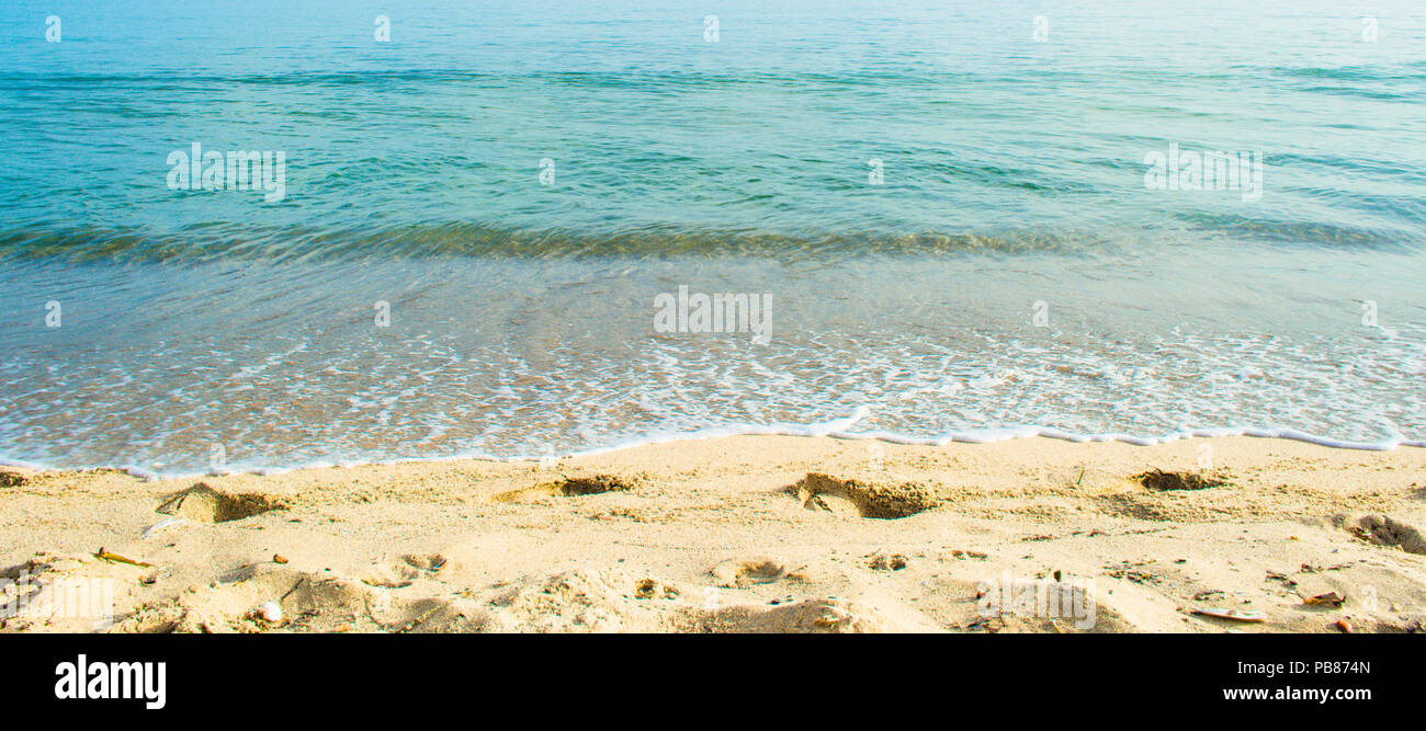 crystal clear water on the beach in summer morning Stock Photo - Alamy