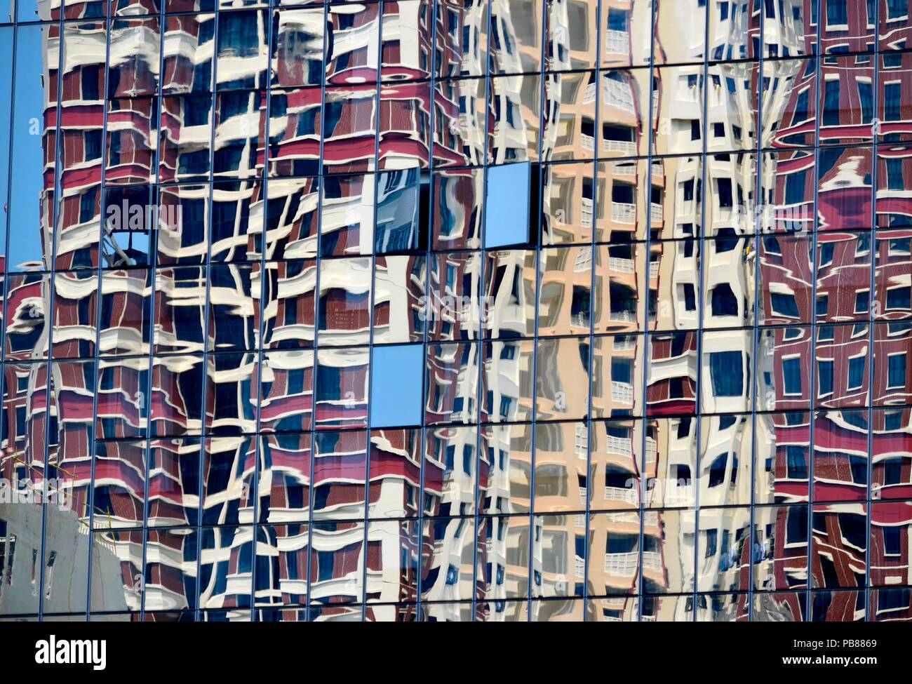 Front view of large modern office building in Singapore with glass ...