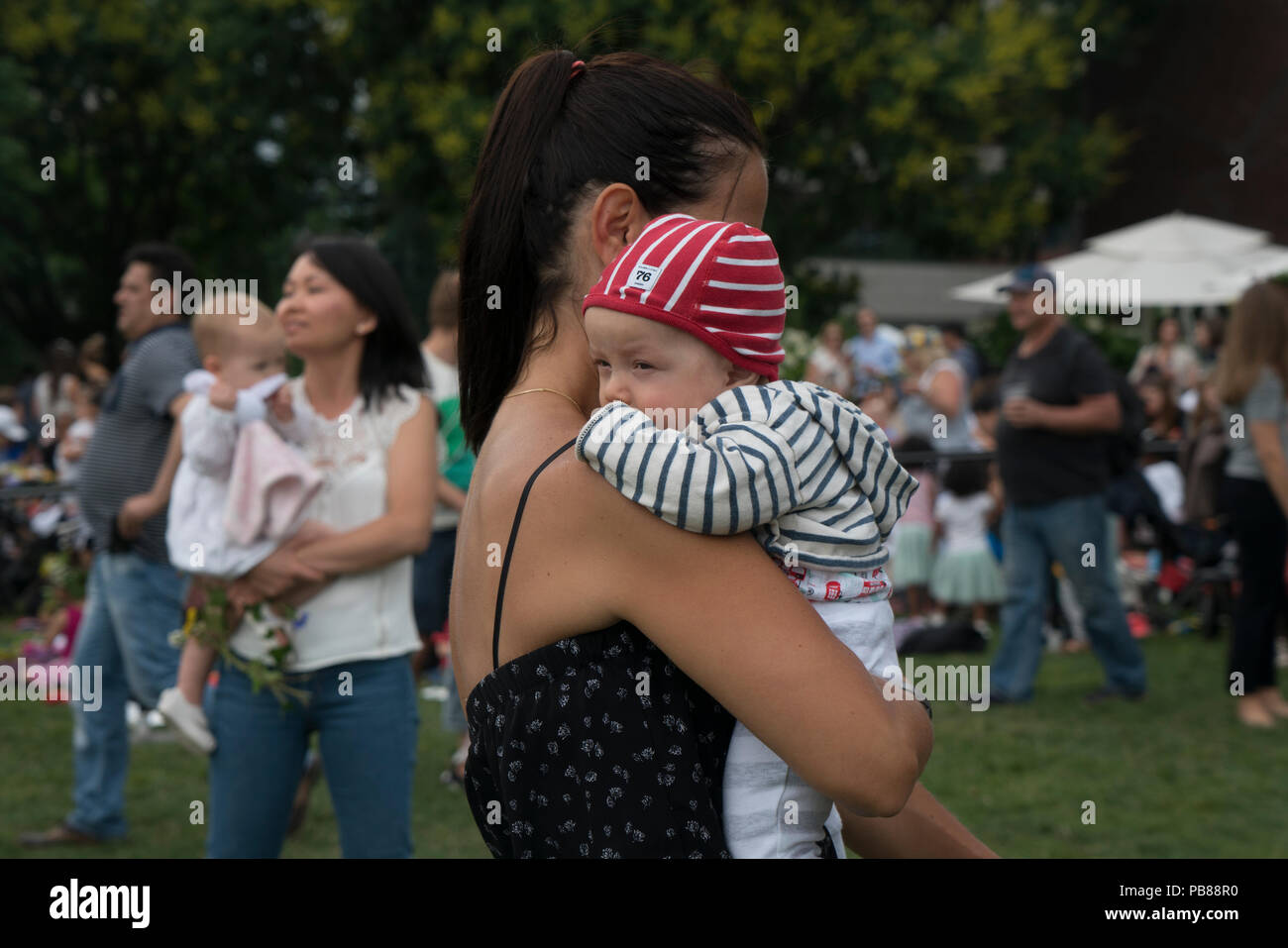 Mothers carried their young children during the annual Swedish ...