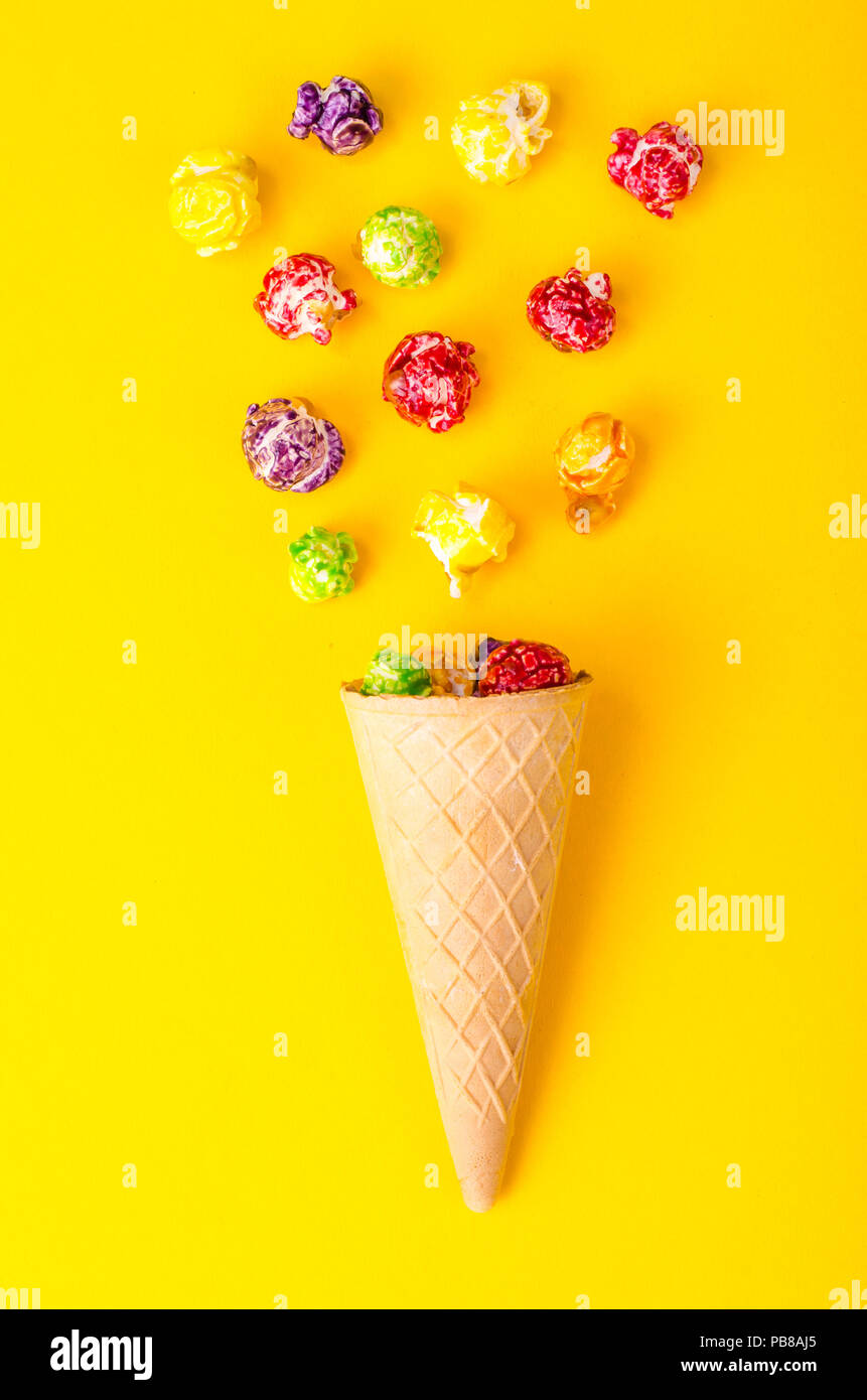 Sweet colored popcorn on bright background. Studio Photo Stock Photo ...