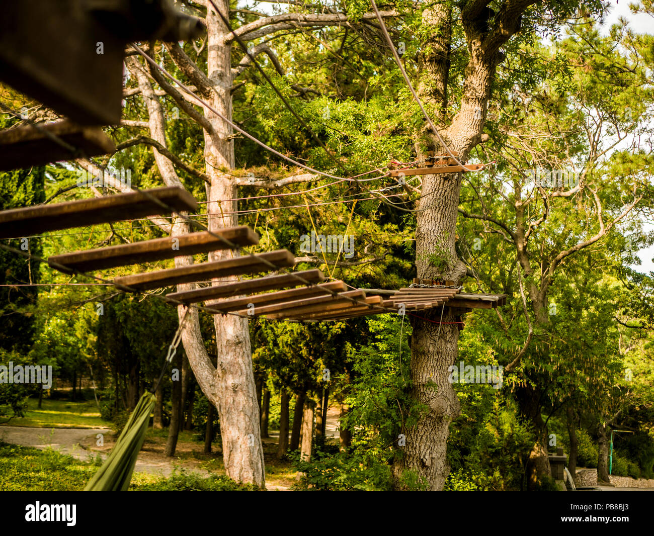 Child crossing rope bridge hi-res stock photography and images - Alamy