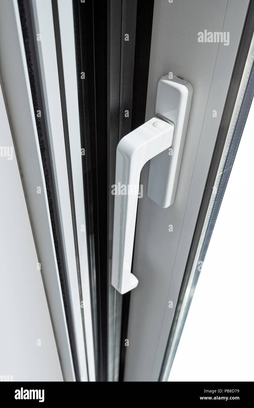 Sliding glass door handle opening on garden Stock Photo - Alamy