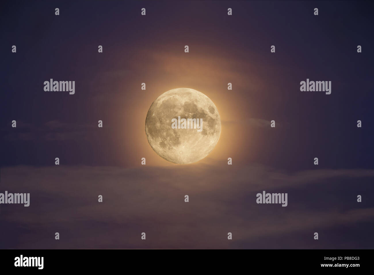 Bright full moon against dark clouds Stock Photo - Alamy