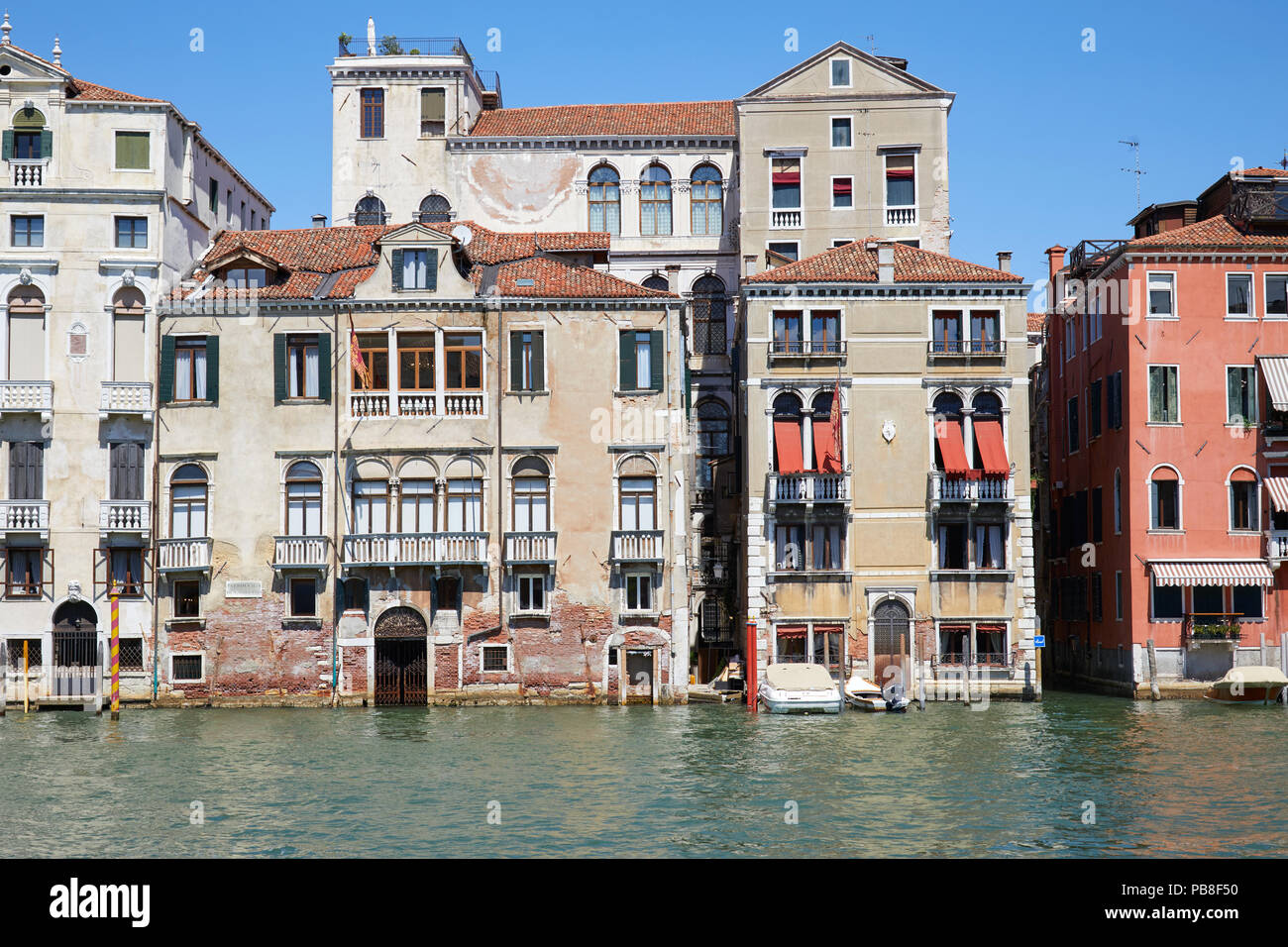 Venice buildings facades and canal in a sunny day in Italy, nobody ...