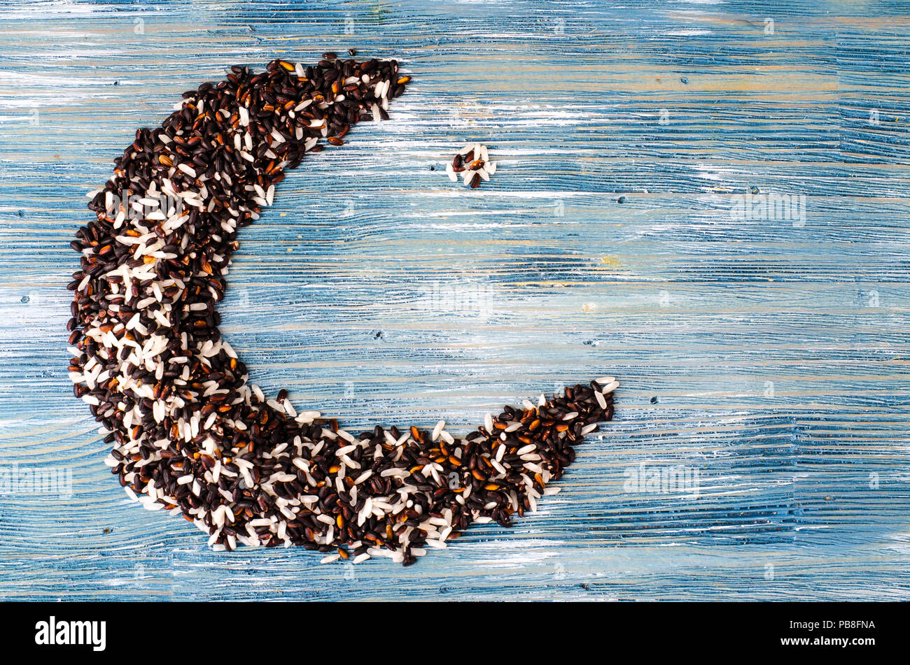 Uncooked rice different varieties arranged in moon shape. Ramadan food ...