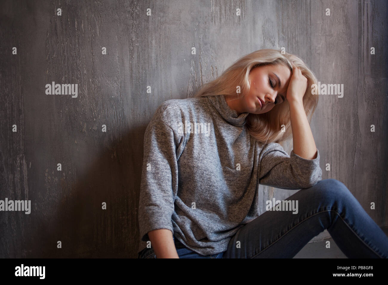 chronic fatigue syndrome. Young woman tired. Depressed girl sitting on ...