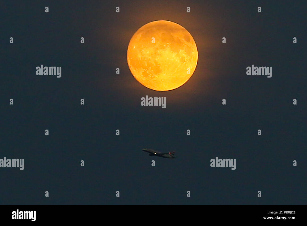 Ba plane underneath blood moon hi-res stock photography and images - Alamy
