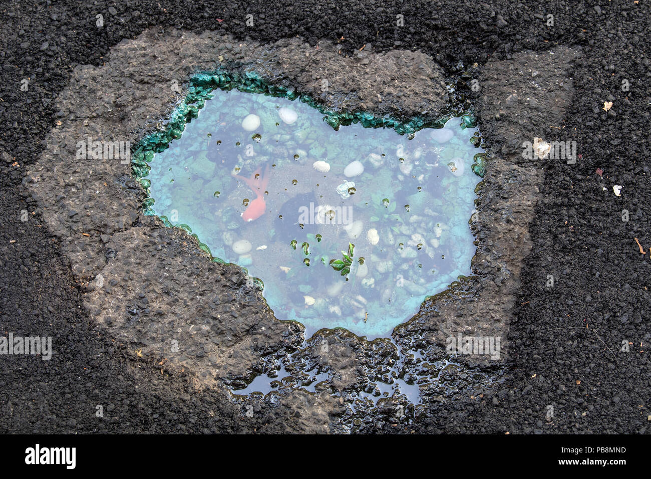 Moenchengladbach, Germany. 27th July, 2018. A pothole has been ...