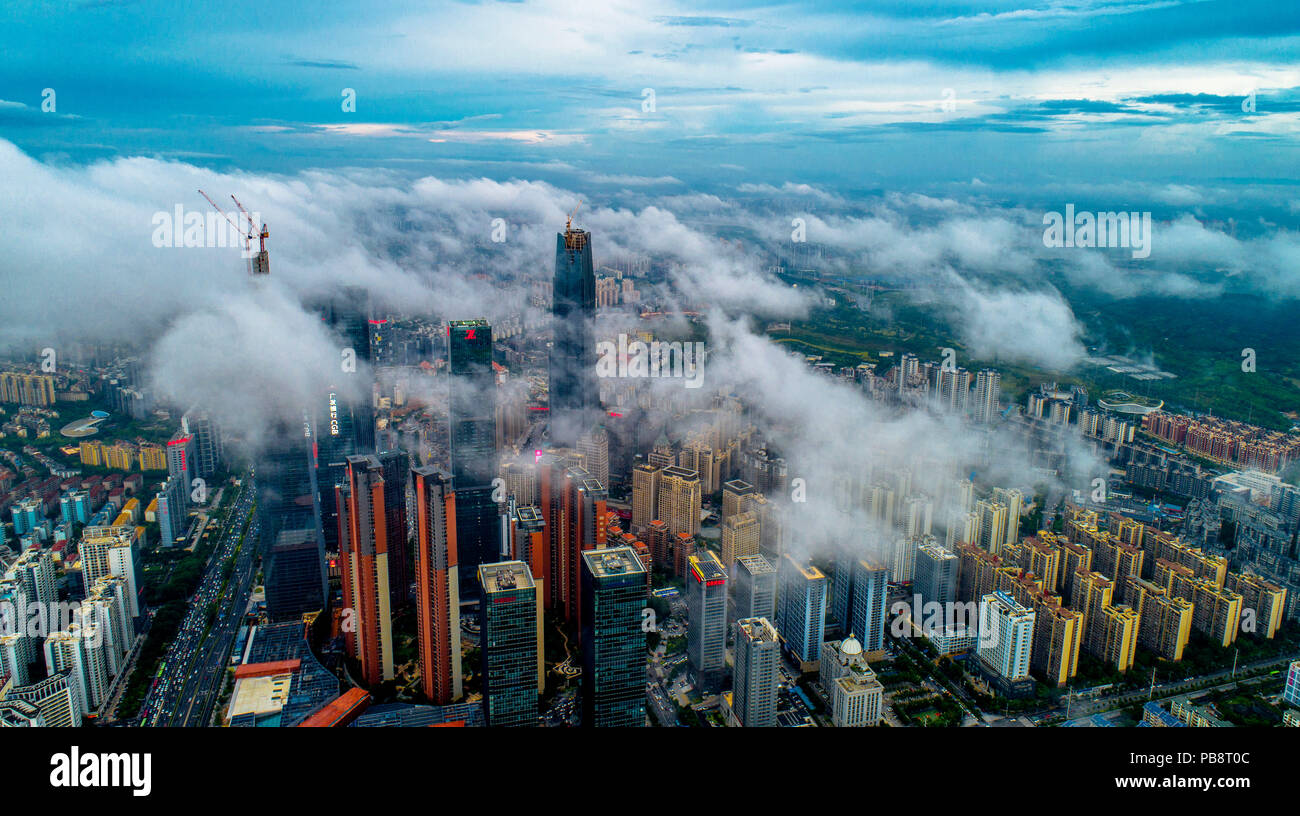 Nanning, Guangxi, China, 27th July 2018. The mist wreathed up after the ...