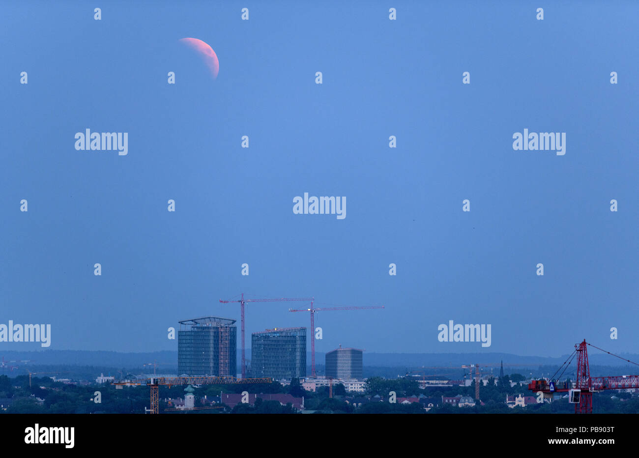 Munich, Germany. 27th July, 2018. The rising moon can be seen in the ...
