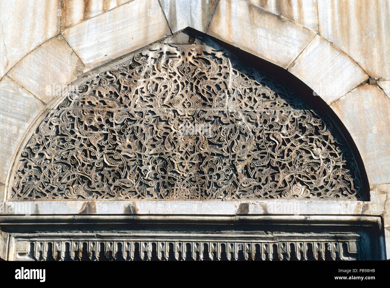 stone carved arabesques on tympanum, Yeshil Jami, Bursa, Turkey Stock ...