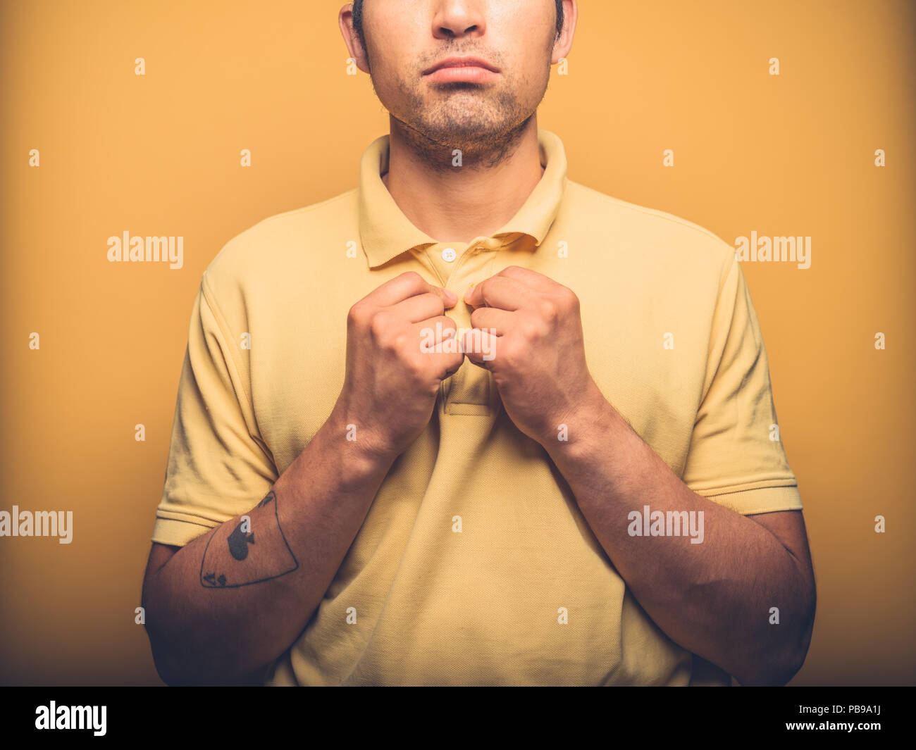 Yellow polo shirt hi-res stock photography and images - Alamy
