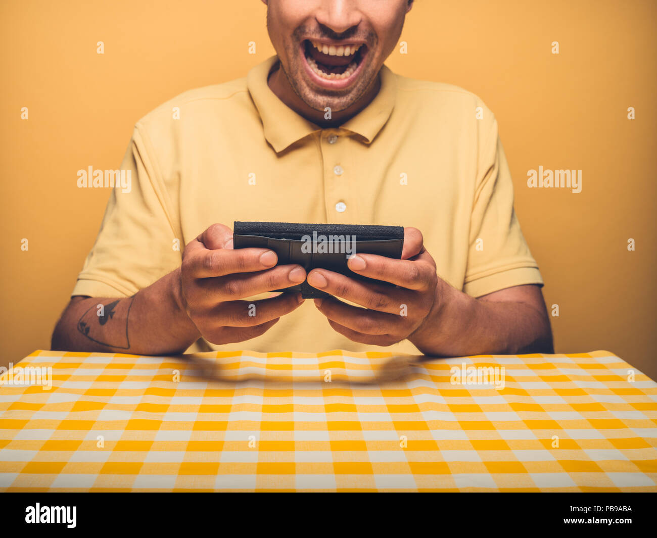 Young man watching something funny hi-res stock photography and images ...