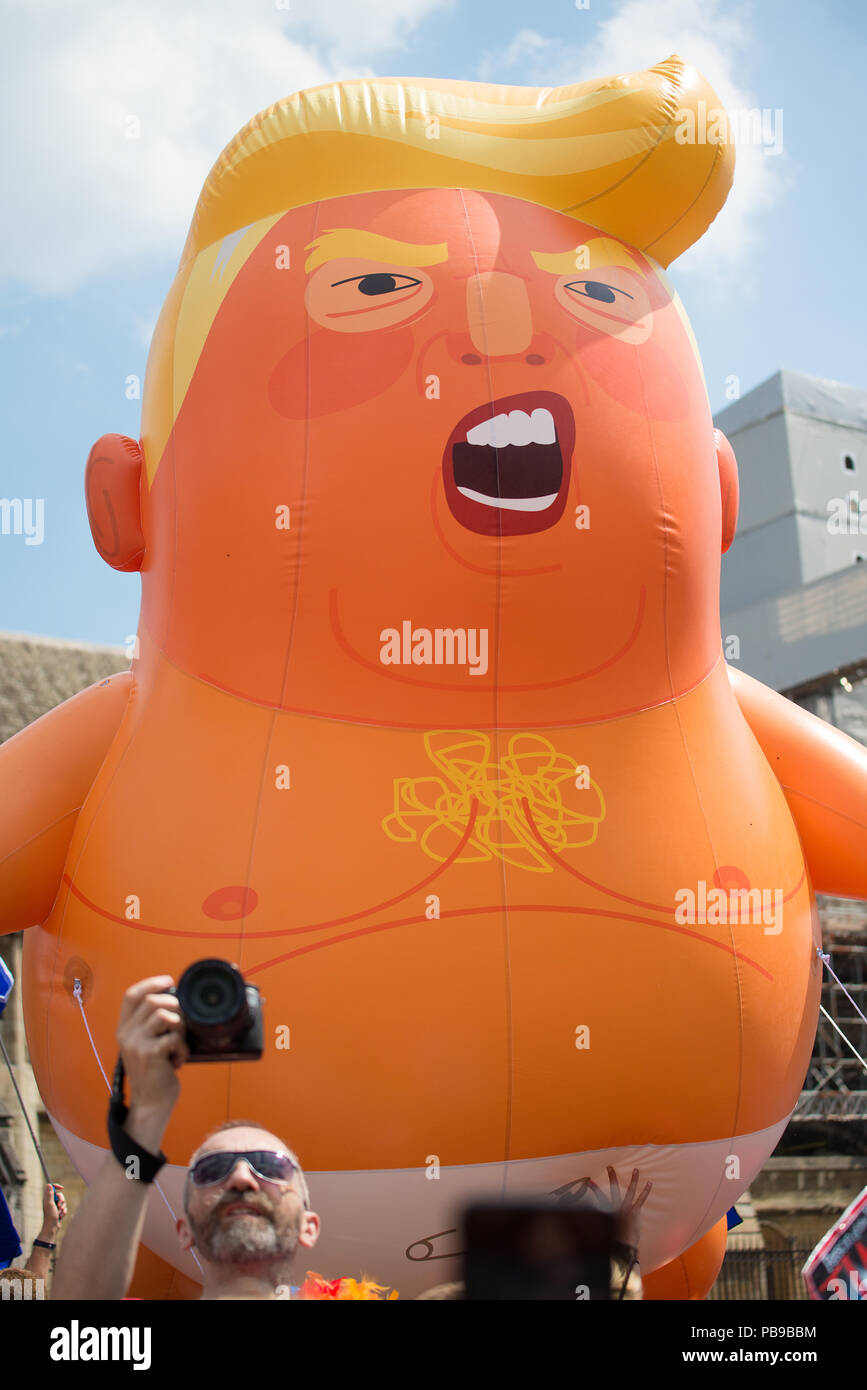 The Baby Trump blimp being paraded around Parliament Square, London, UK ...
