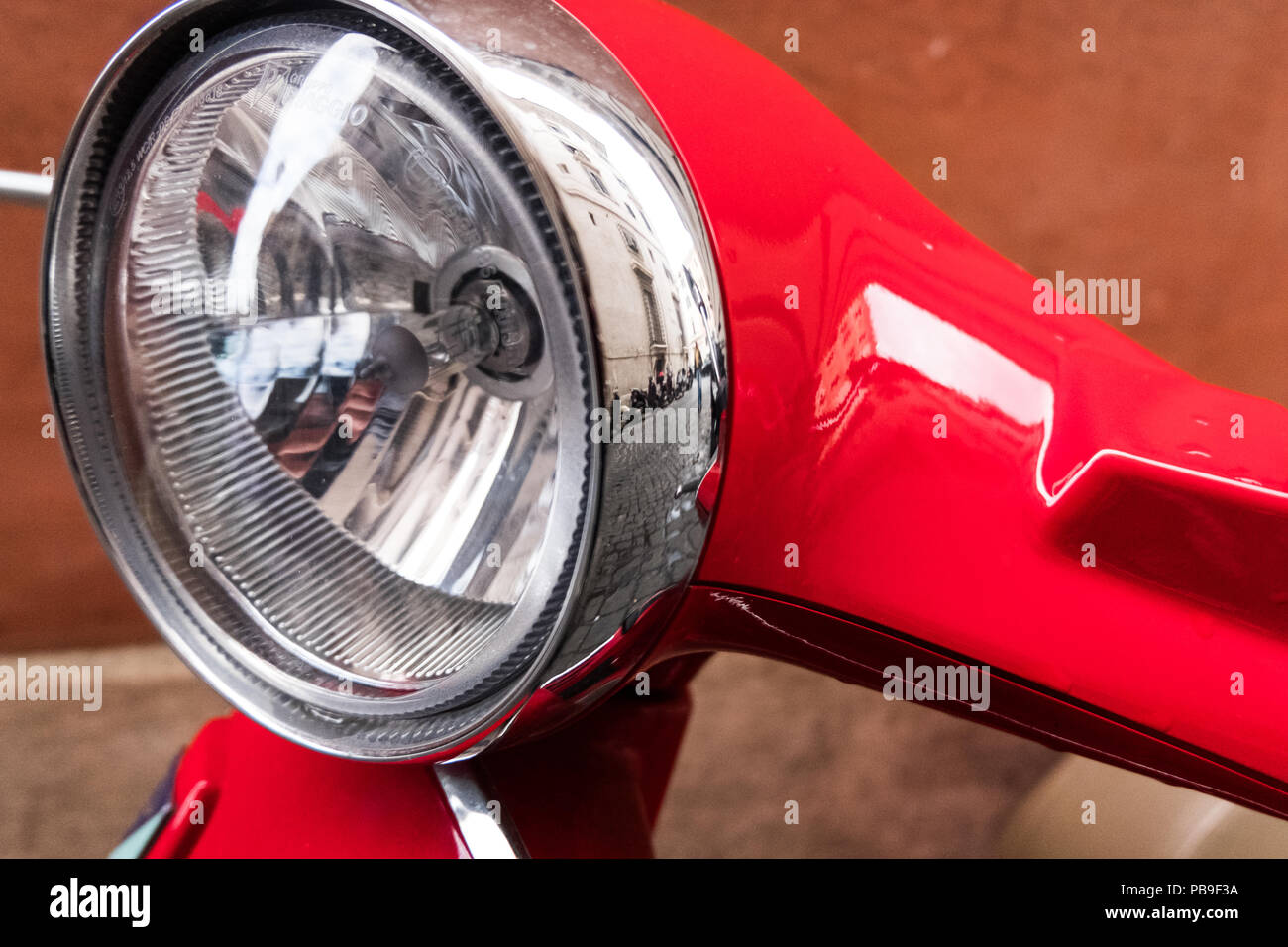 Classic round light of a Vespa scooter Stock Photo - Alamy