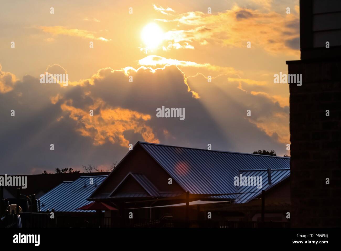 Summer sunset over clouds Stock Photo - Alamy