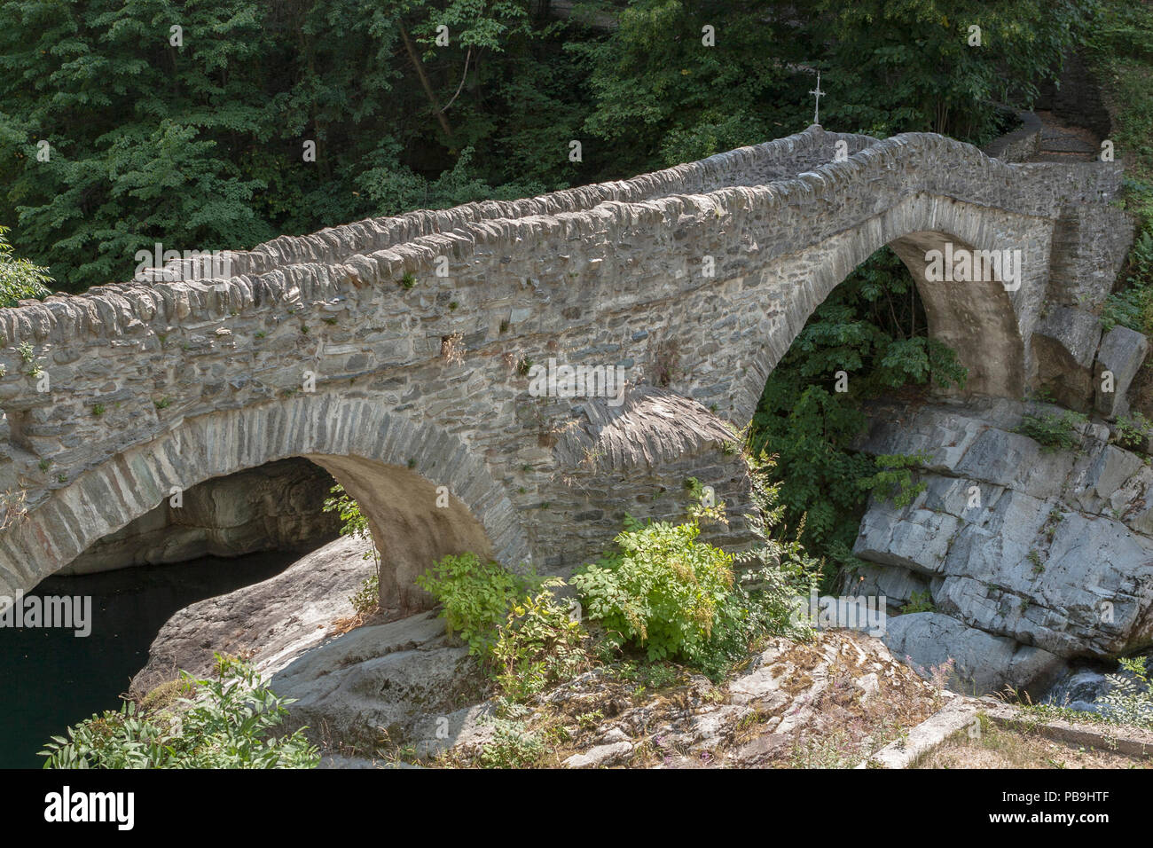 An ancient double arch stone bridge in Pontboset, Champorcher Valley ...