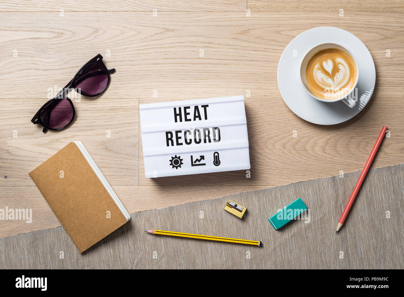 Heat record written on light box with sun and thermometer icons as ...