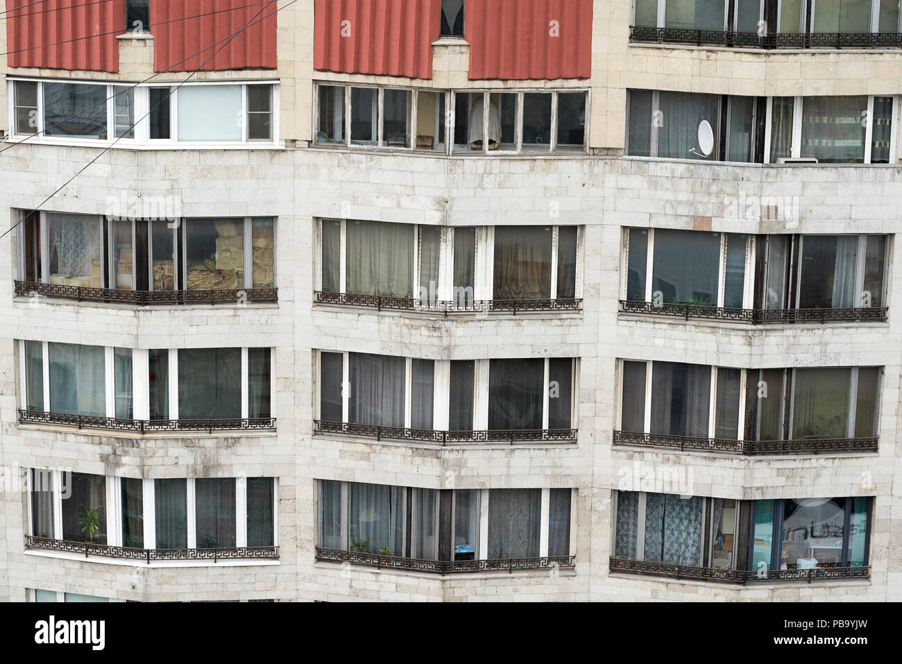Windows of a multi-storey residential building as a background Stock ...