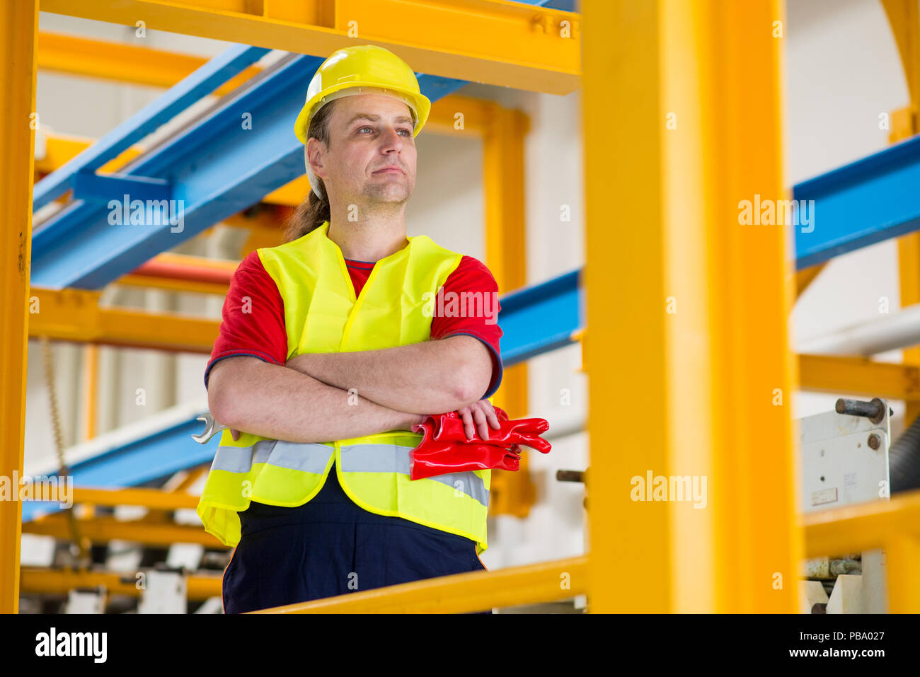Man in work uniform arms crossed hi-res stock photography and images ...