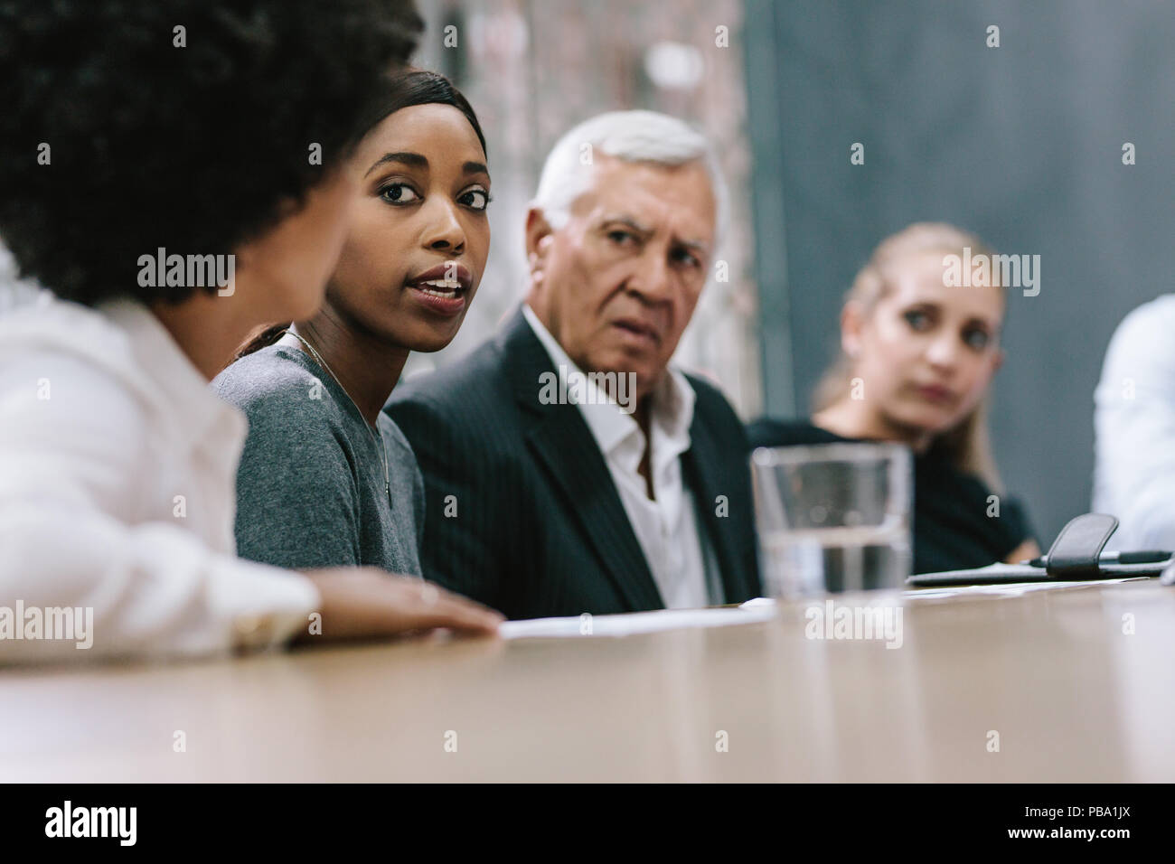 African woman sitting forward hi-res stock photography and images - Alamy