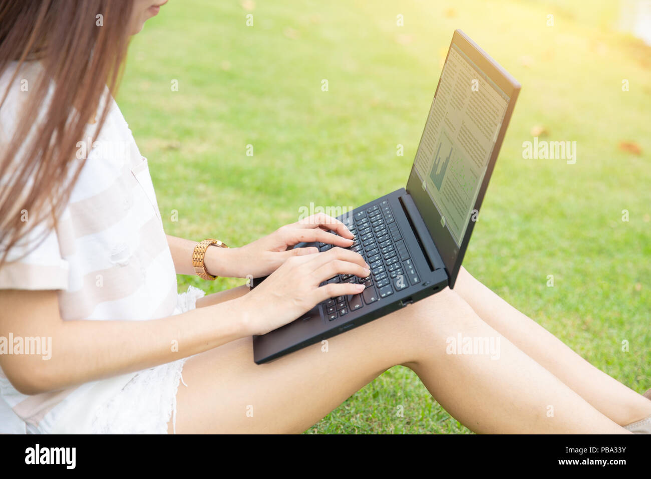 Young asian teen laptop computer hi-res stock photography and images ...