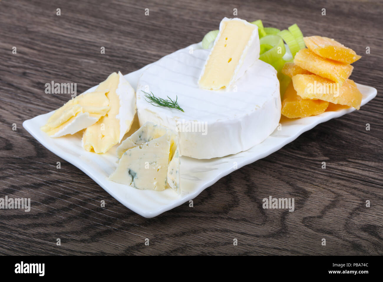 Cheese platter with brie, blue and parmesan Stock Photo - Alamy