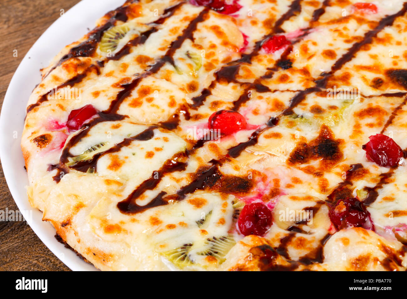 Sweet pizza with fruits and mozzarella Stock Photo - Alamy