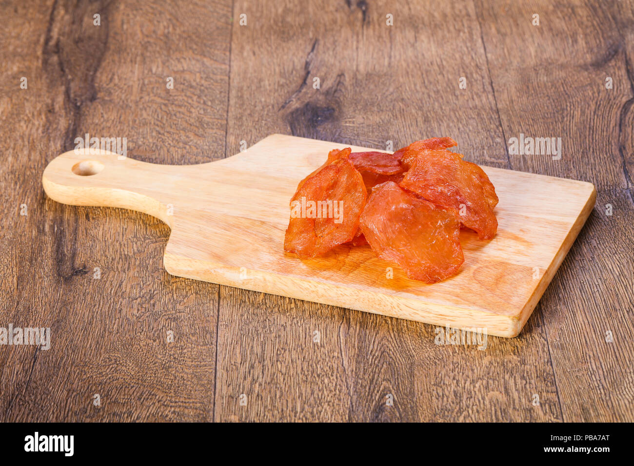 Dry chicken meat over wooden Stock Photo - Alamy