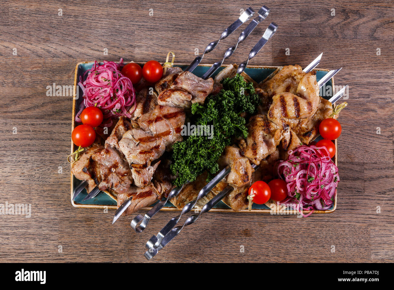 Grilled chicken and pork barbeque Stock Photo - Alamy