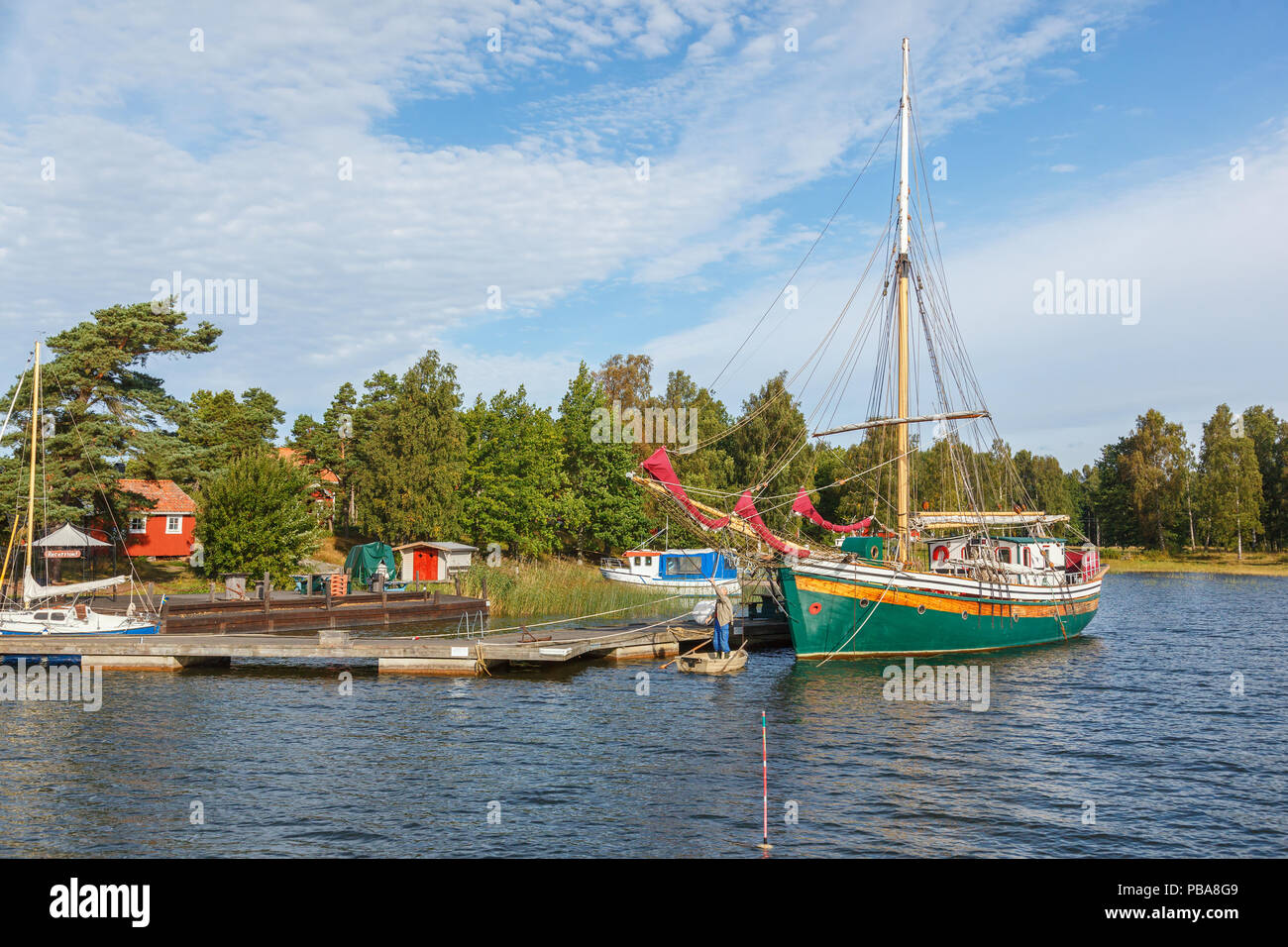Sailboat in harbor at an archipelago island Stock Photo - Alamy