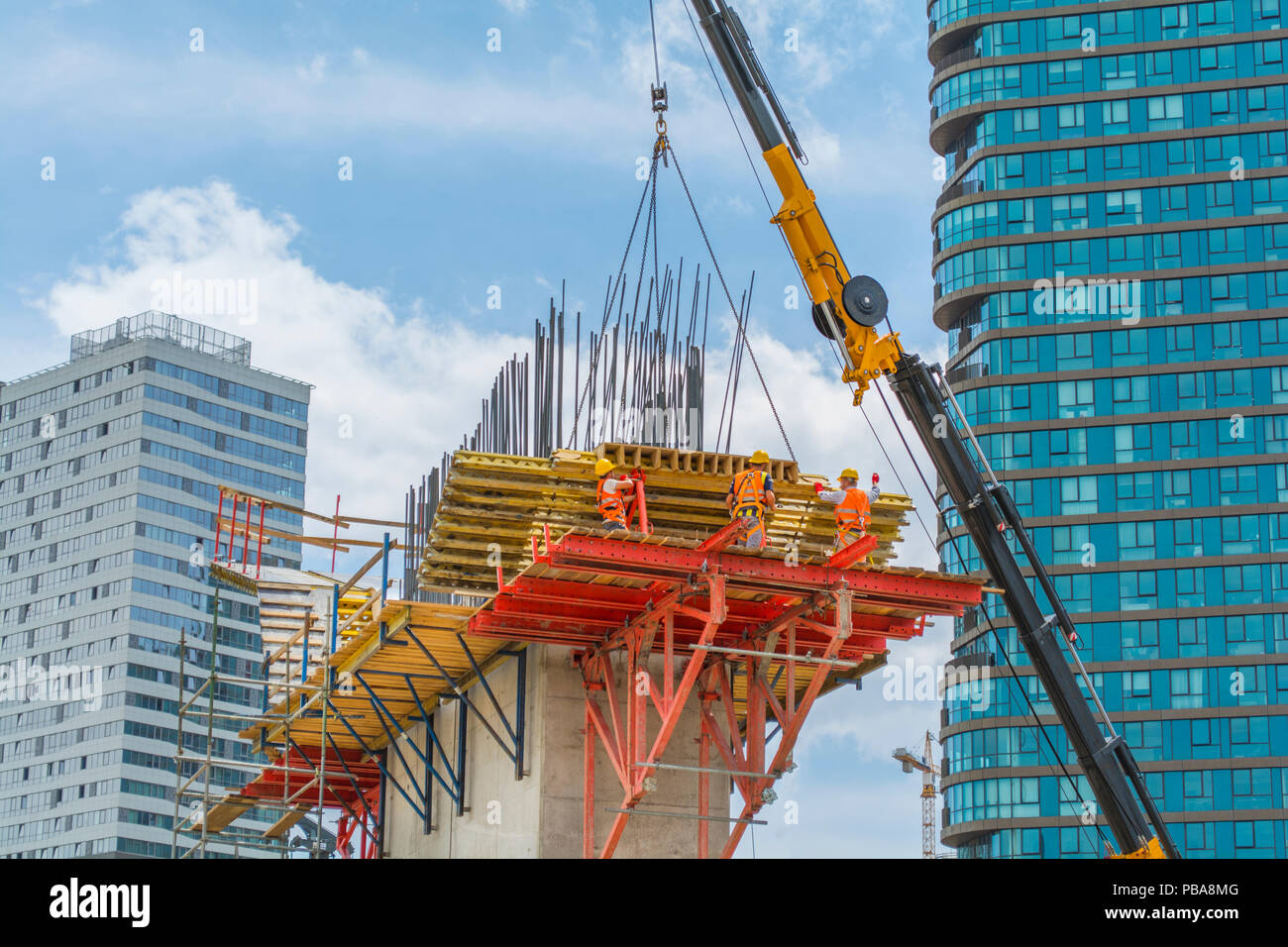 Engineers and construction workers are working on road construction ...