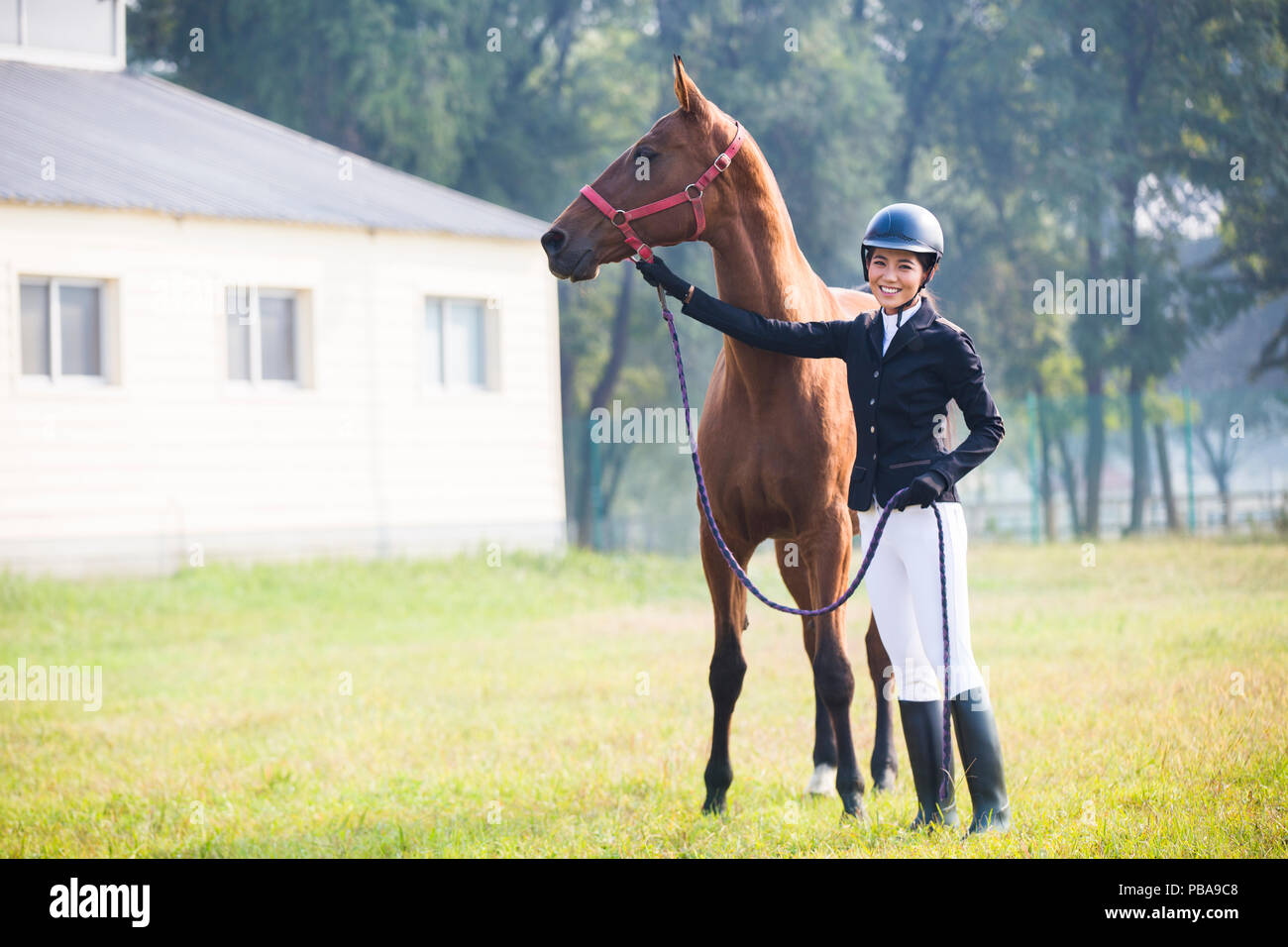 Chinese young woman riding horse hi-res stock photography and images ...