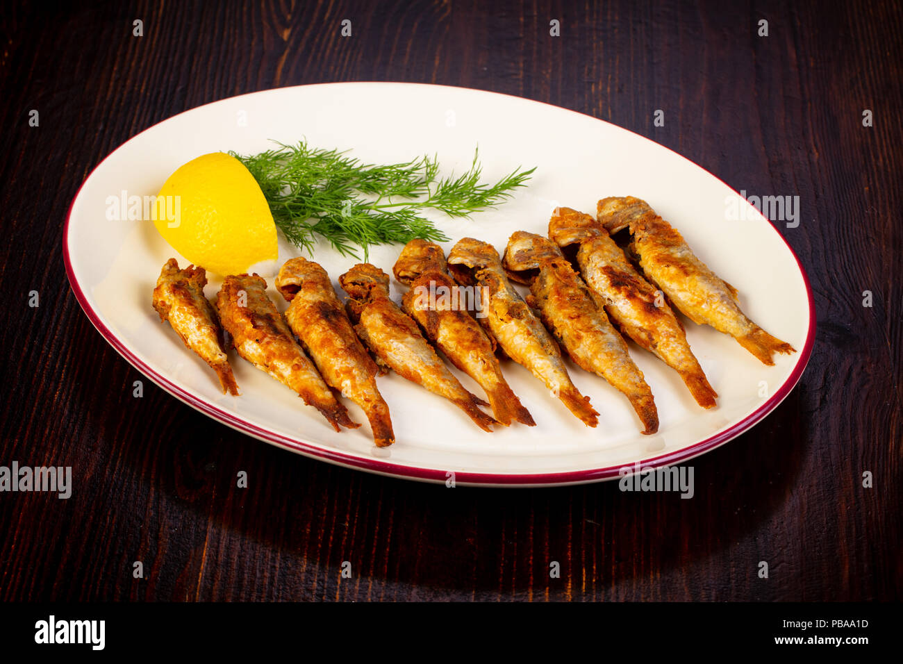 Surmullet fish with lemon and dill Stock Photo - Alamy
