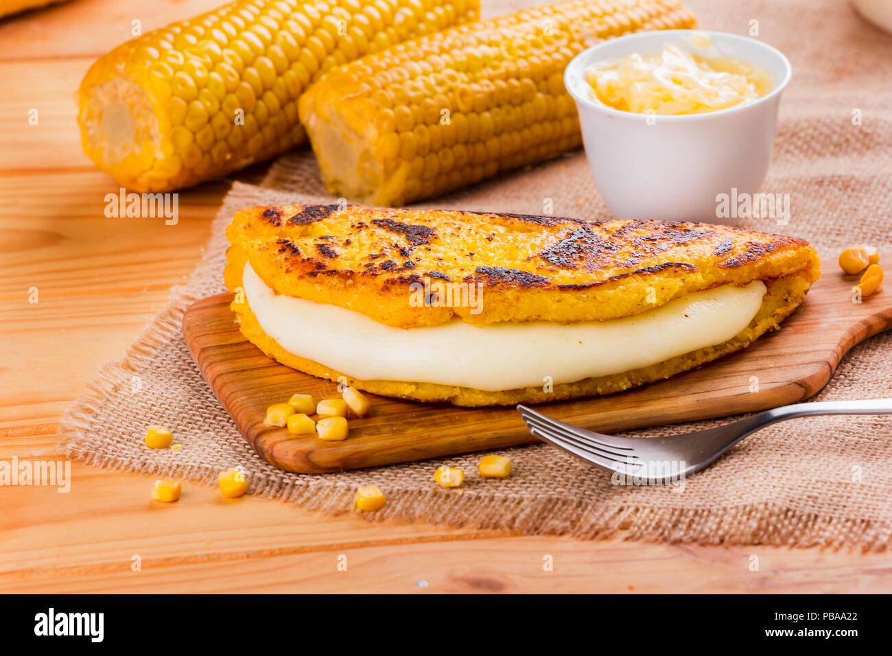 Cachapa with cheese, typical Venezuelan dish made with corn, cheese and ...