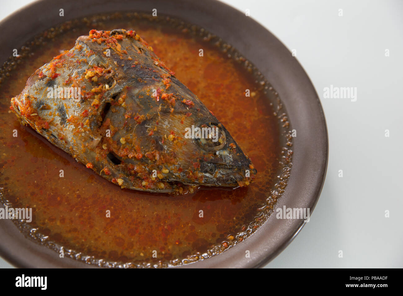 traditional indonesian dishes fish head gulai Stock Photo - Alamy