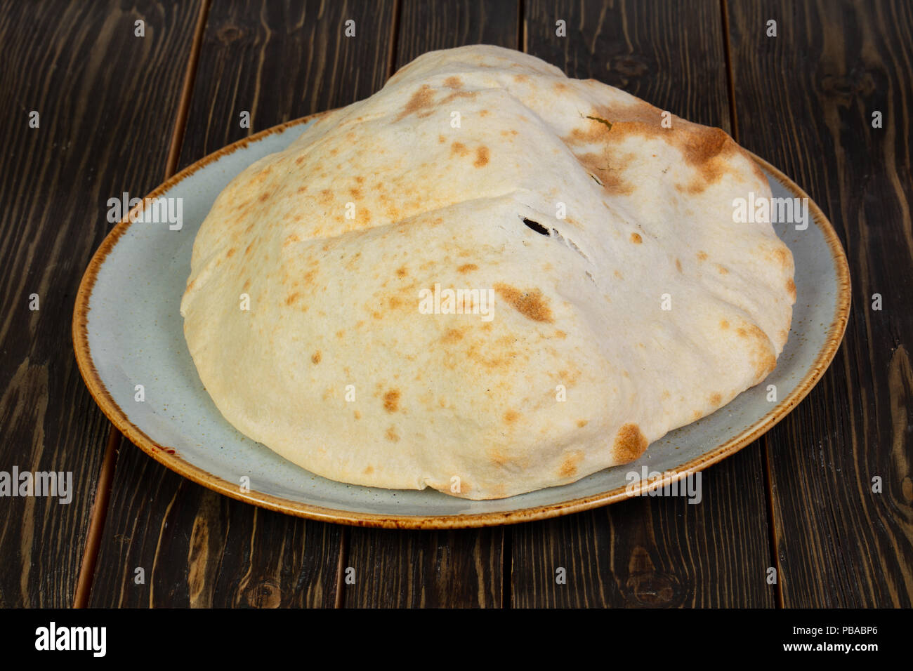 Handmade bread Lepeshka over wooden Stock Photo - Alamy