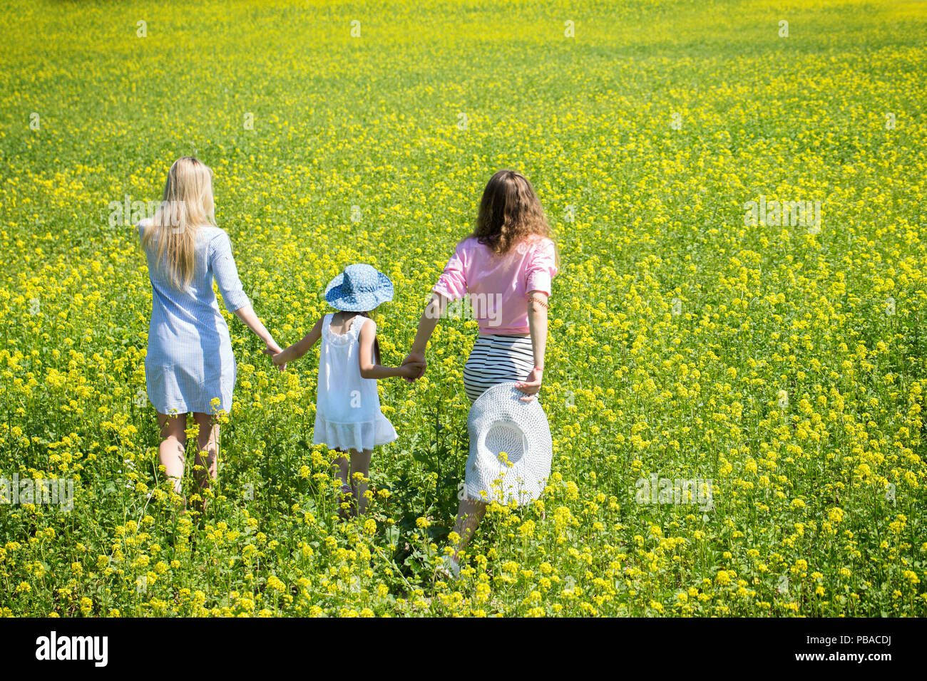 two women with a child Stock Photo - Alamy