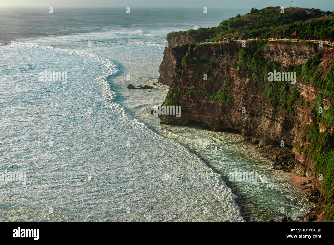 Rock Uluwatu temple and waves, Bali, Indonesia Stock Photo - Alamy